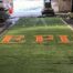 Basic Quality Used Logo Marked Turf | 15ft. Wide | Shipped