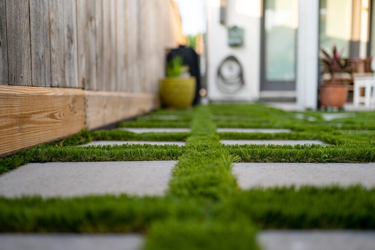 Artificial Turf vs Concrete/Pavers: Comparison Guide